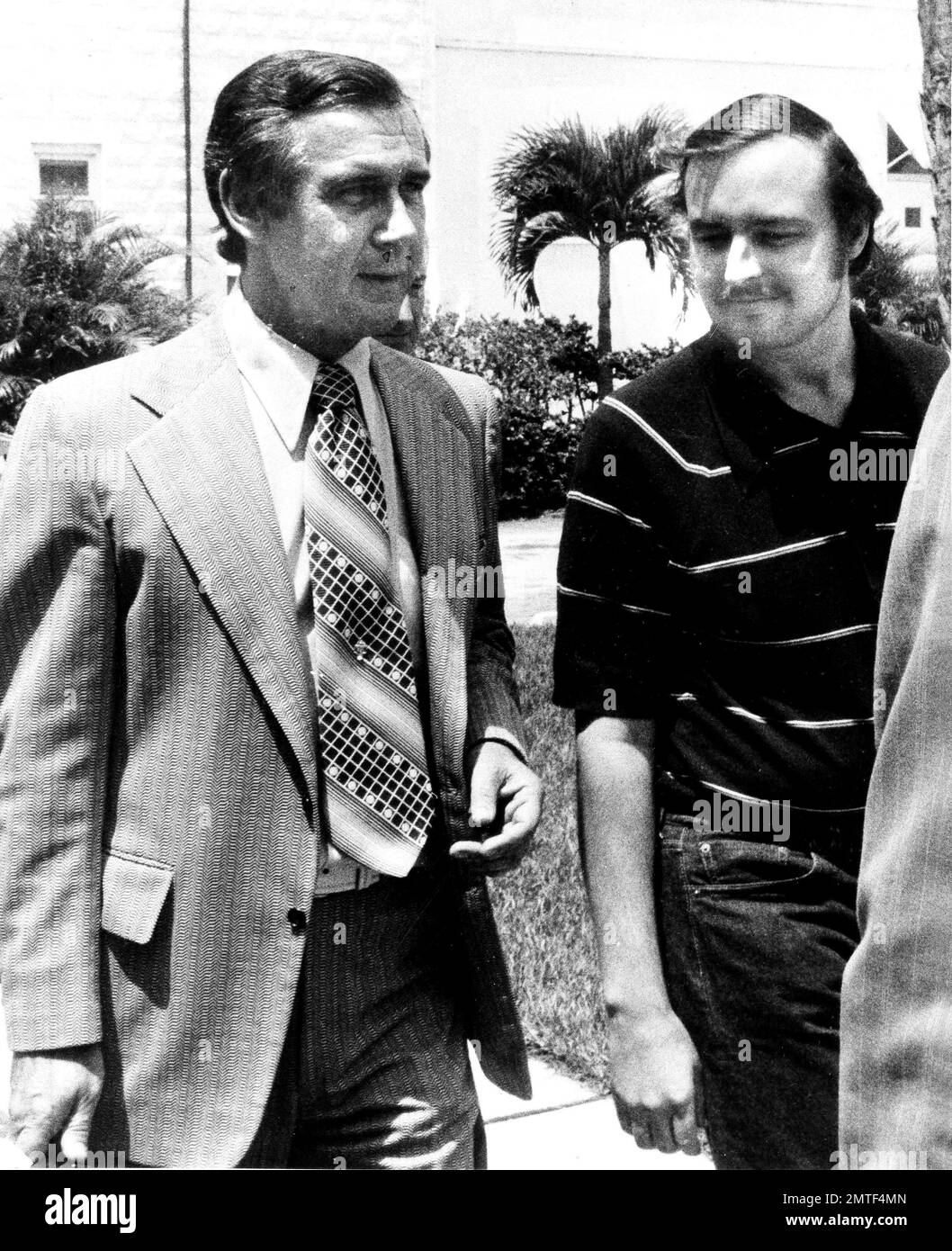 Gerald John Schaefer, right, walks with his public defender Elton ...