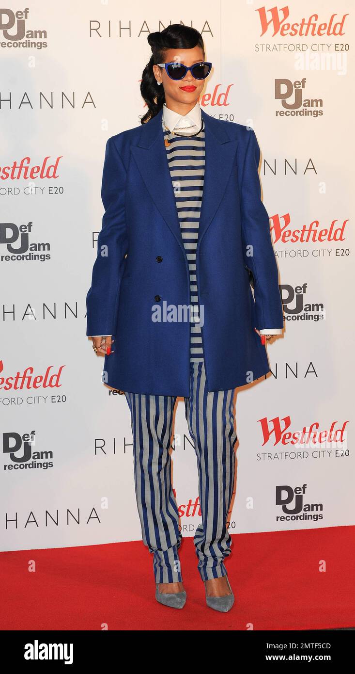 Wearing a bright blue outfit, Rihanna Switches on the Christmas Lights ...