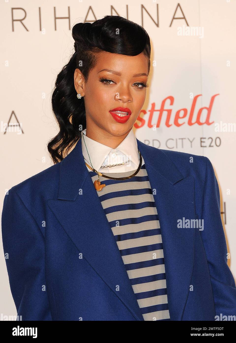 Wearing a bright blue outfit, Rihanna Switches on the Christmas Lights ...
