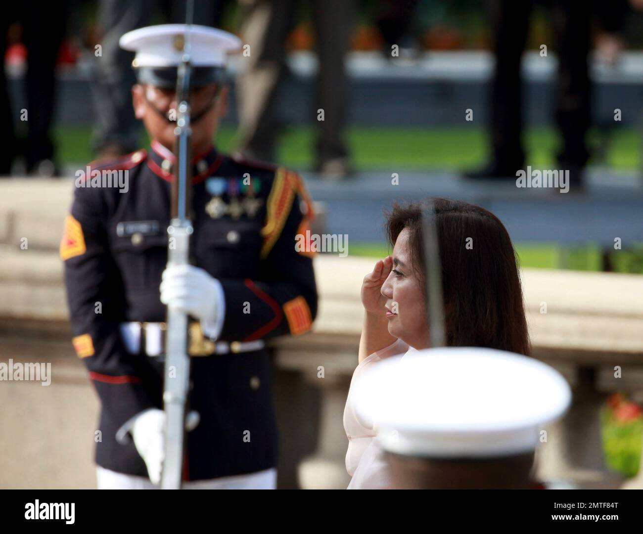 Philippine Vice President Leni Robredo salutes after laying a wreath at ...