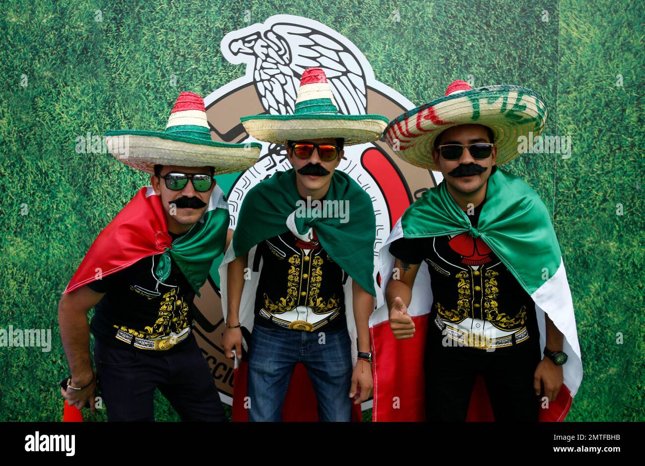 Mexico's fans pose for pictures as they arrive for a World Cup soccer ...