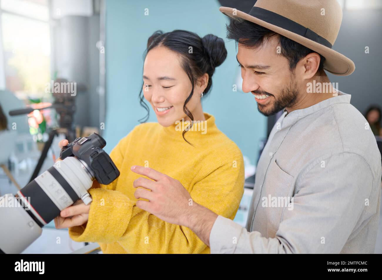 Creative, photography and photographer talking to a model while looking ...