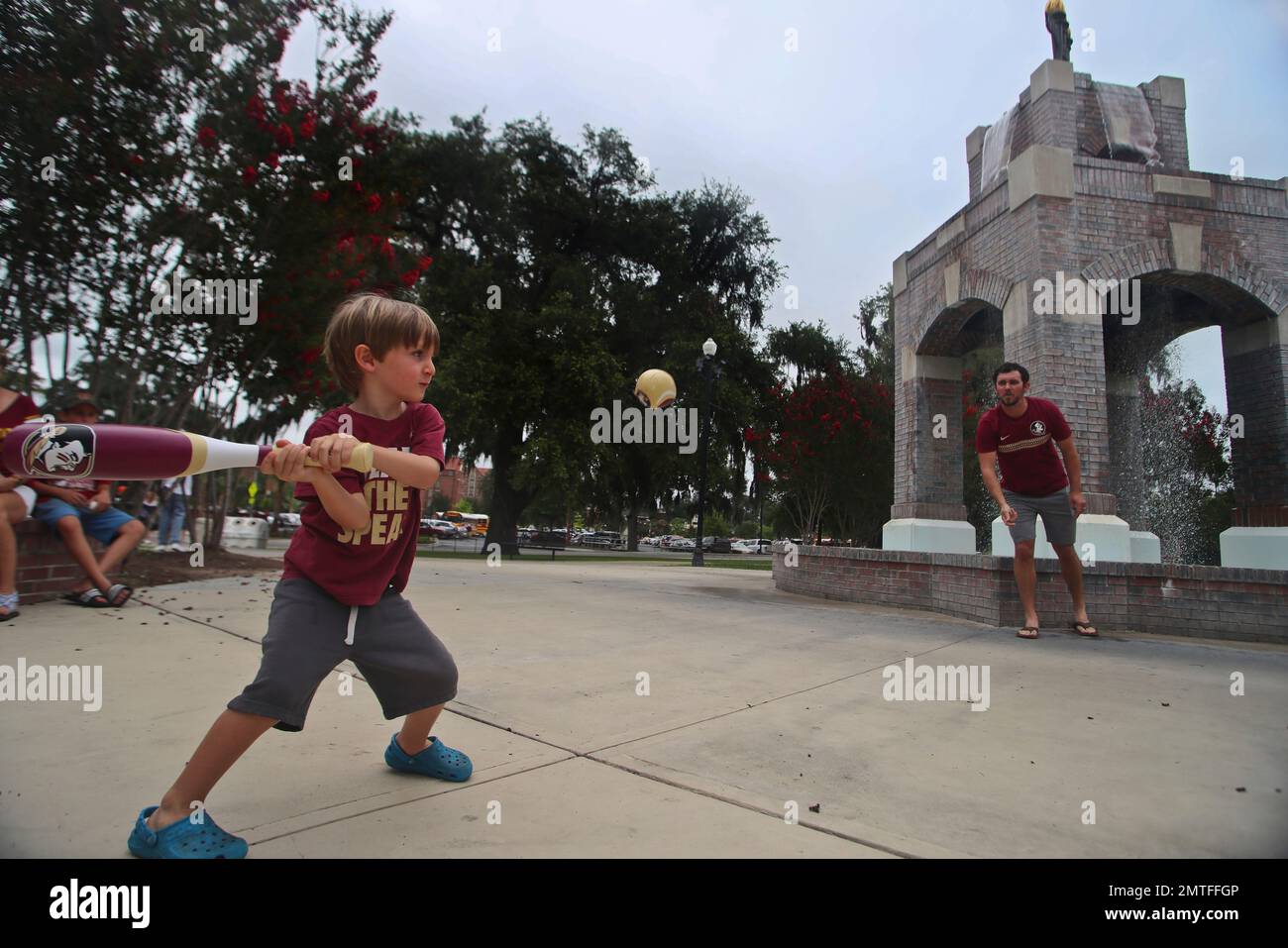 Rory Insalaco, 3, from Lakeland, Fla.,takes a cut at a pitch from his ...
