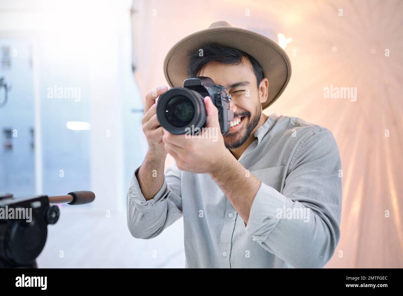 Photographer, camera and man in studio for photoshoot, creative and ...
