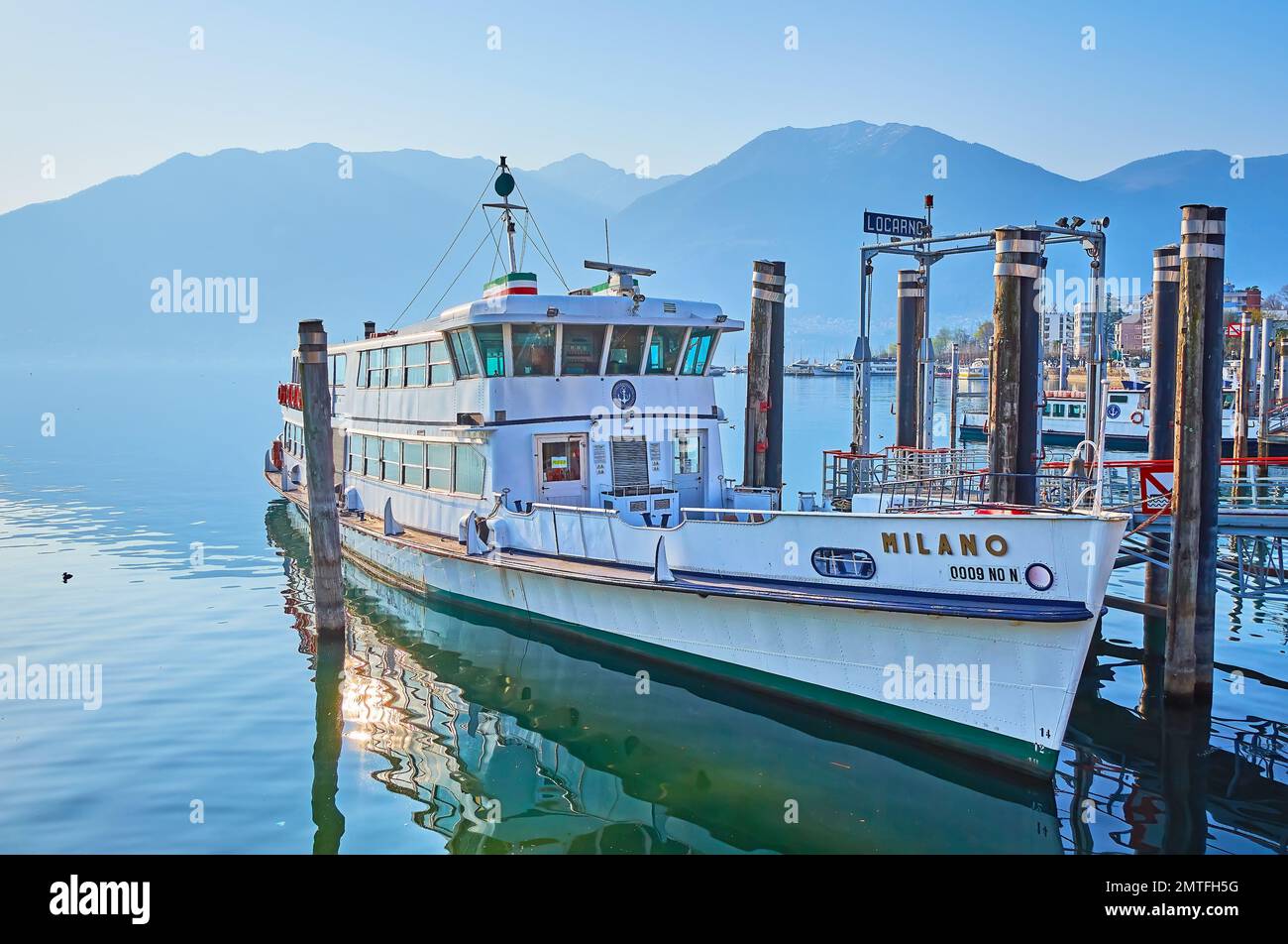 LOCARNO, SWITZERLAND - MARCH 28, 2022: The ferry, moored in harbor of ...