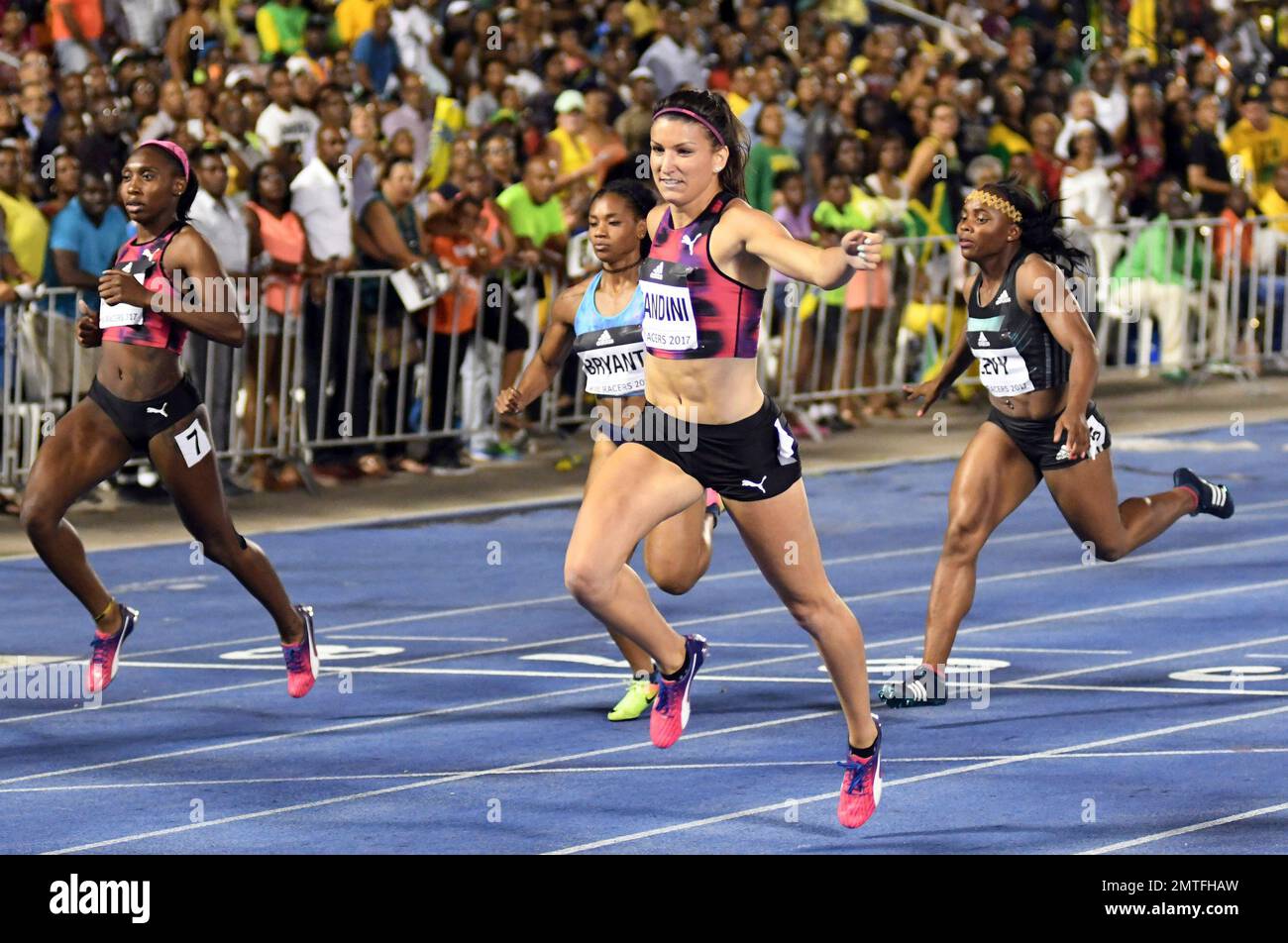 United States' Jenna Prandini, center, wins the women's 200m race ...