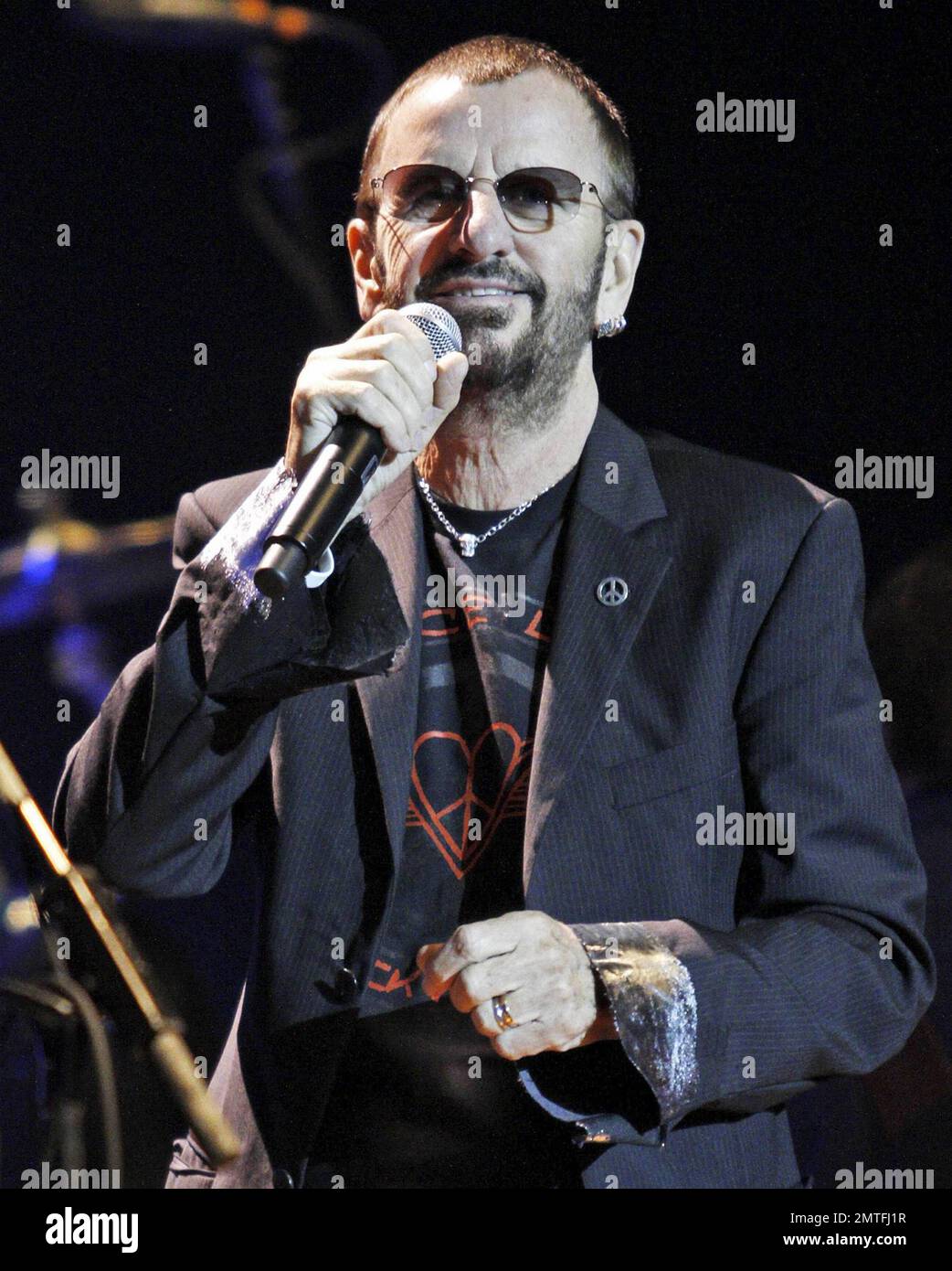 Former Beatle Ringo Starr (Richard Starkey) sings and plays the drums ...