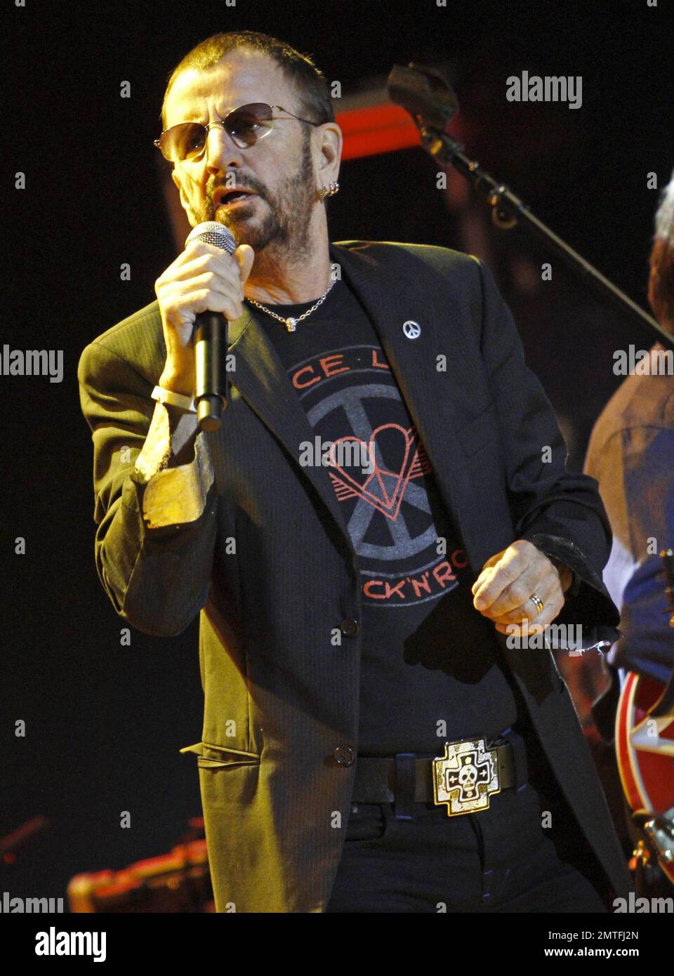 Former Beatle Ringo Starr (Richard Starkey) sings and plays the drums ...