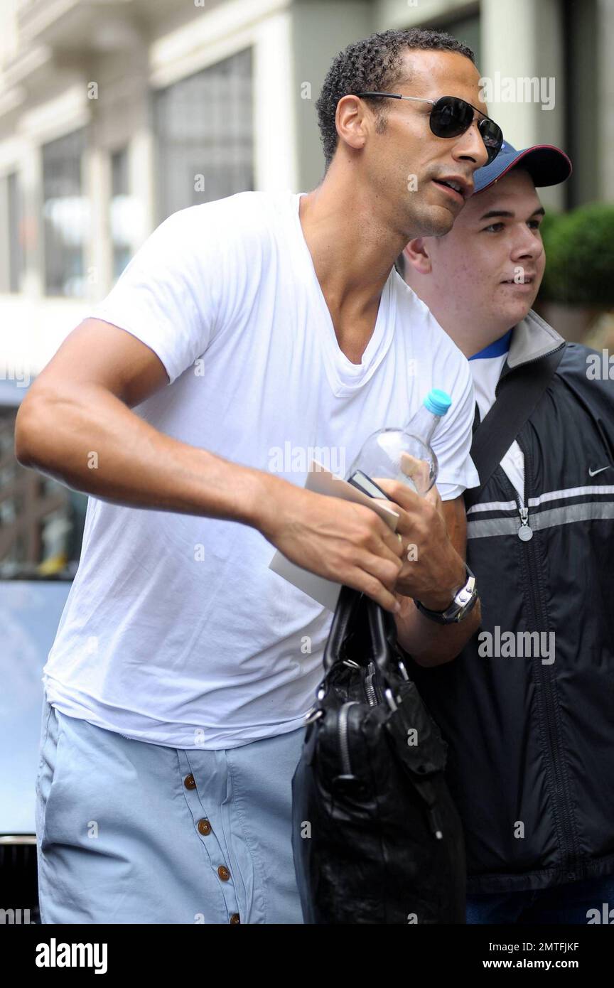 English footballer Rio Ferdinand poses with fans after leaving his ...