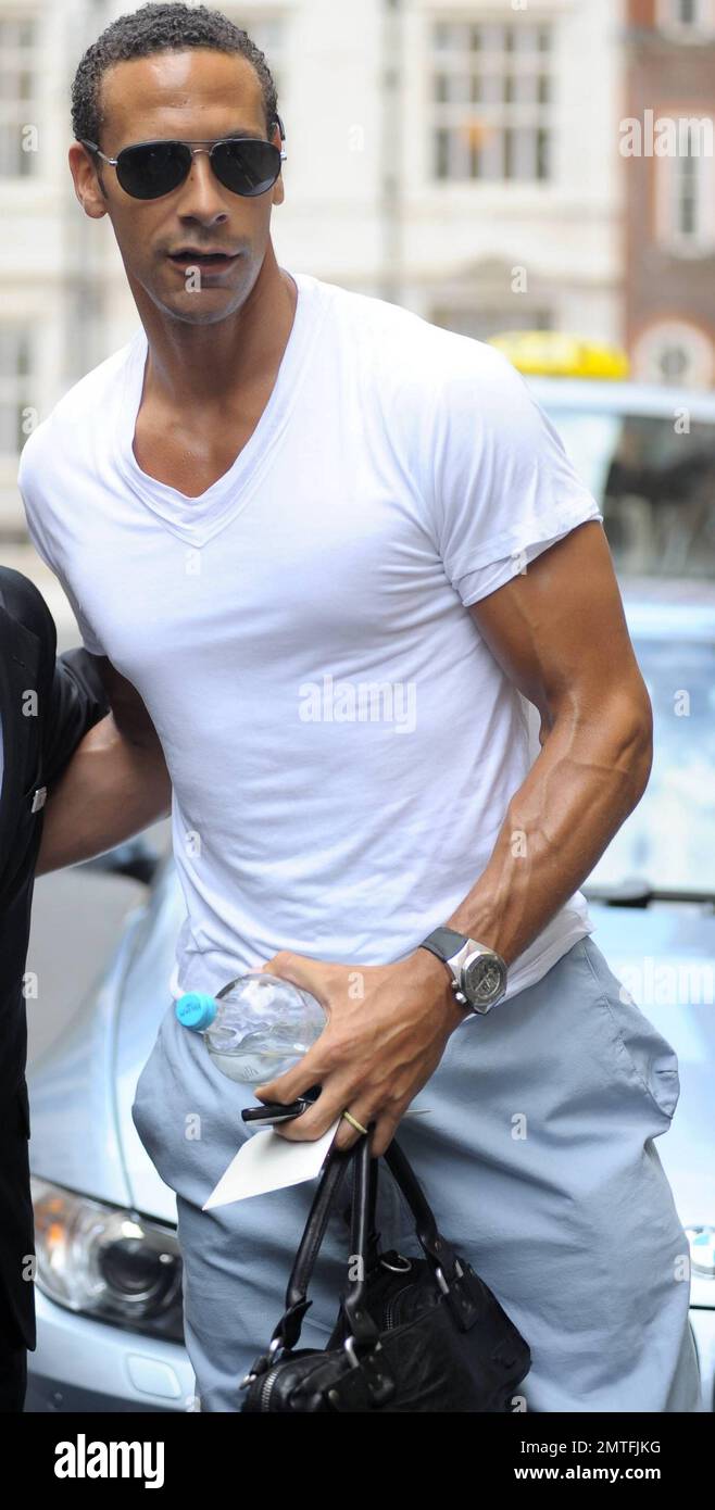 English footballer Rio Ferdinand poses with fans after leaving his ...