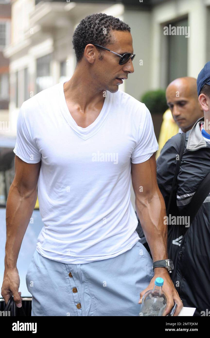 English footballer Rio Ferdinand poses with fans after leaving his ...