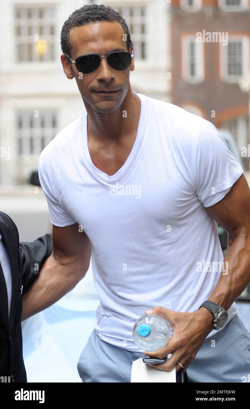 English footballer Rio Ferdinand poses with fans after leaving his ...