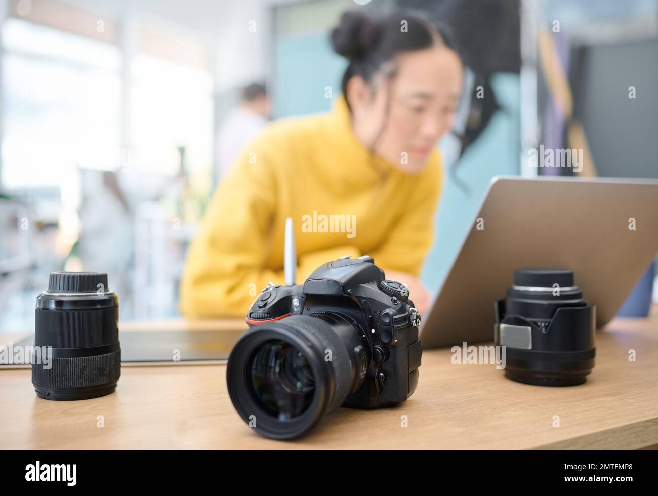 Photography camera, laptop and woman editing photoshoot, focus on ...