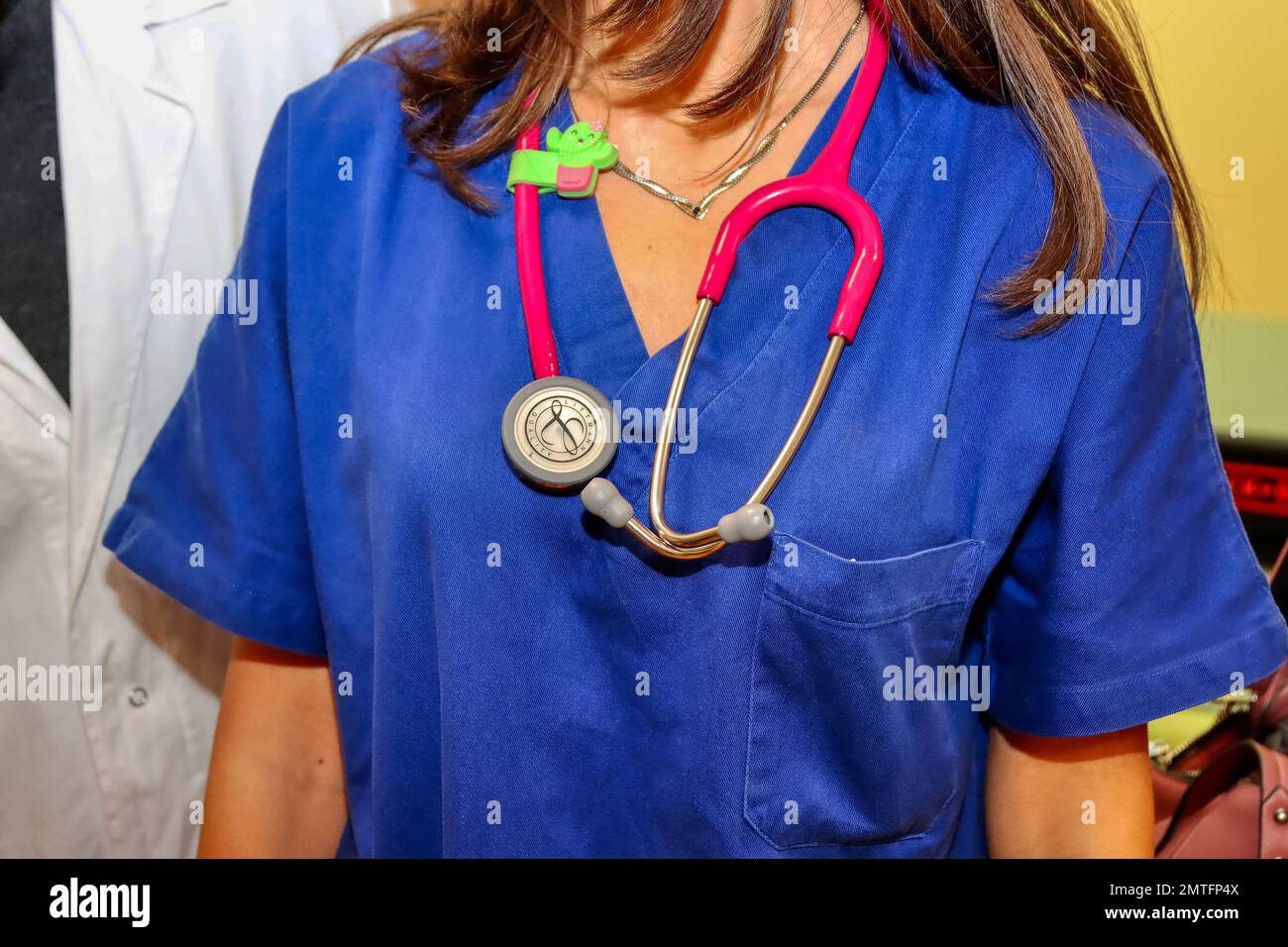 Female doctor with blue coat and stethoscope around her neck., Italy ...