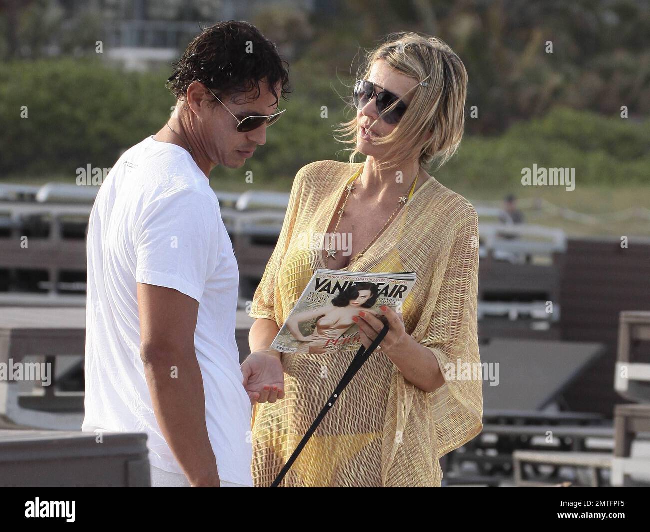 Italian-Croatian movie producer Rita Rusic shows off her tone beach ...