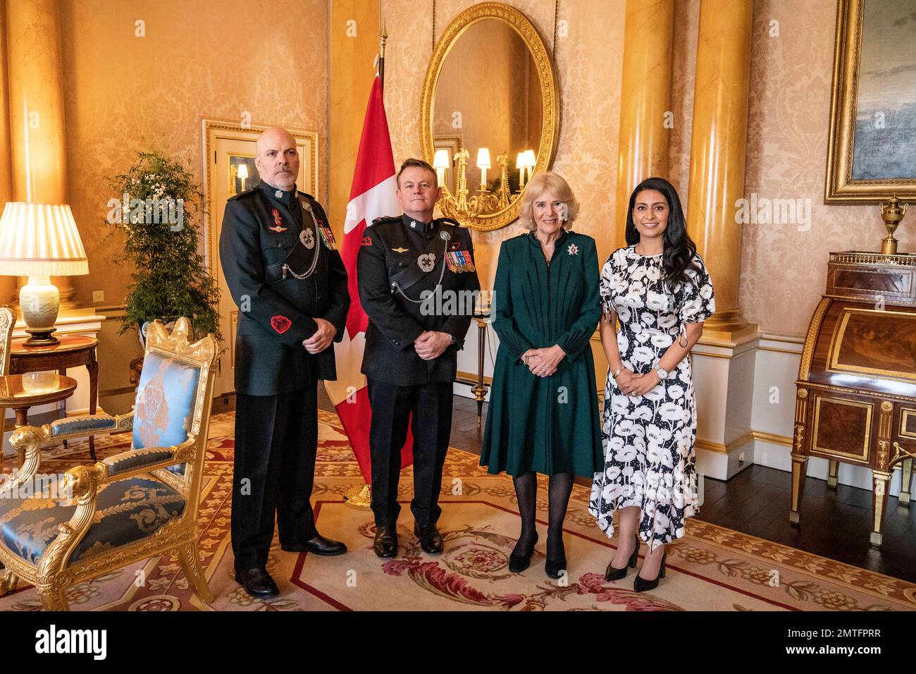 The Queen Consort with guests from the Queen's Own Rifles of Canada after being presented with ...