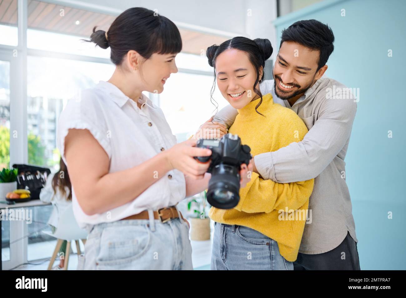 Photography, digital camera and team check photo results, creative ...