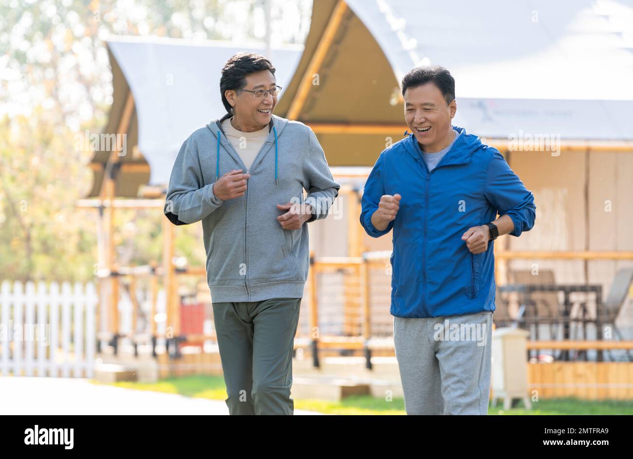 Two wear sports watch old man running fitness in the woods Stock Photo ...