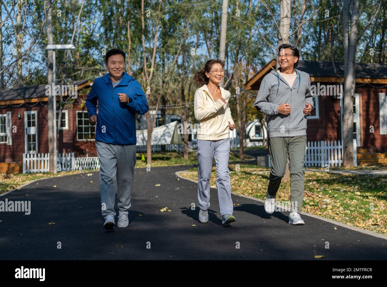 A group of the elderly running fitness with a smile Stock Photo - Alamy