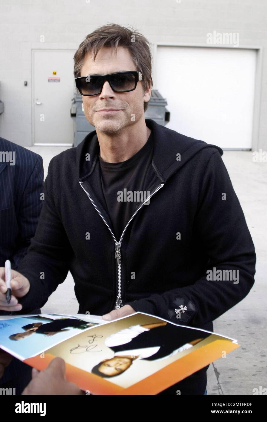 Rob Lowe signs autographs as he arrives at the "Jimmy Kimmel Live ...