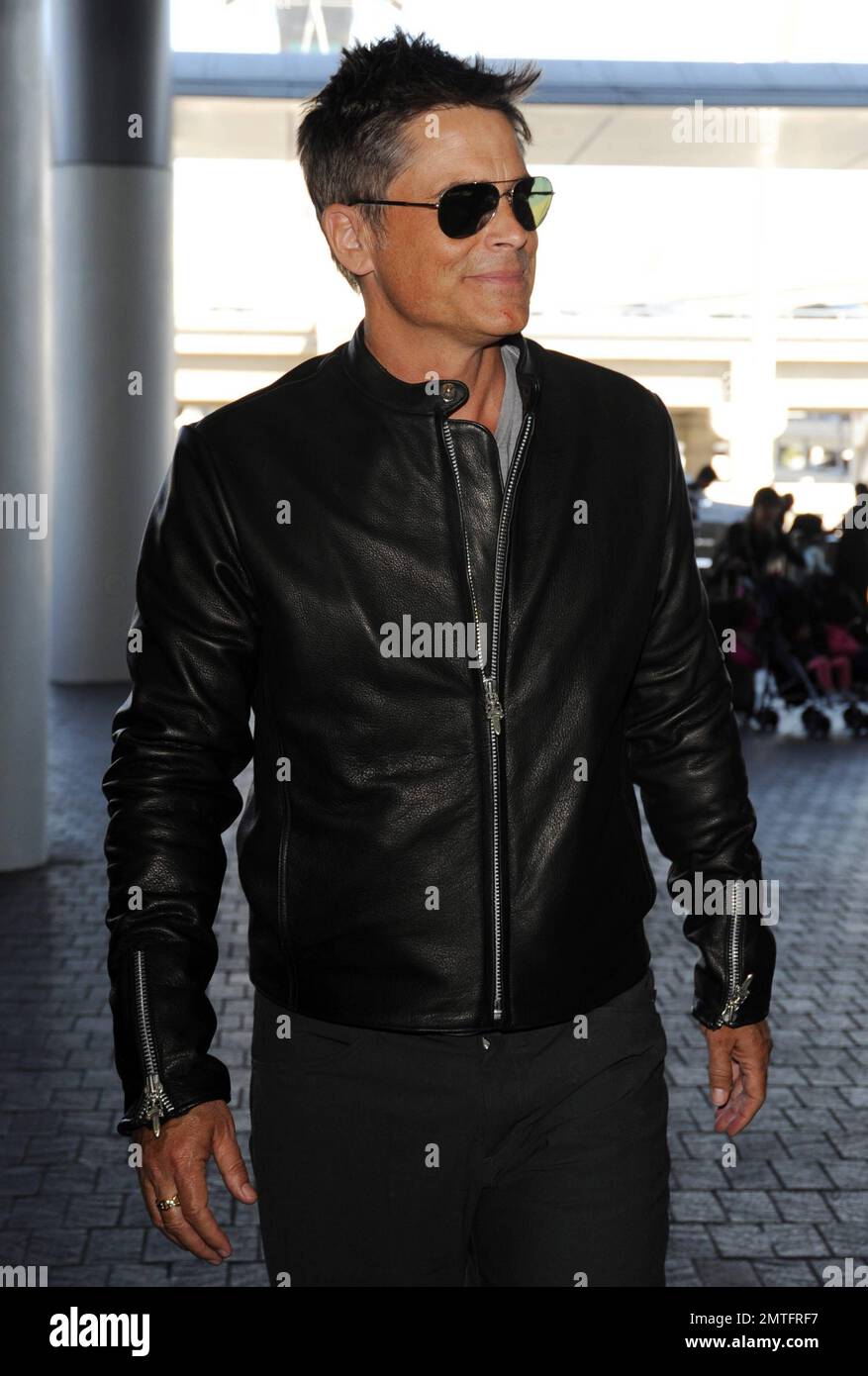 Sporting a fitted leather jacket, Rob Lowe is spotted in LAX airpot ...