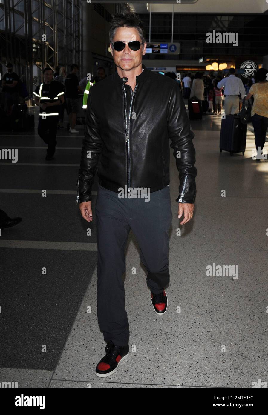 Sporting a fitted leather jacket, Rob Lowe is spotted in LAX airpot ...