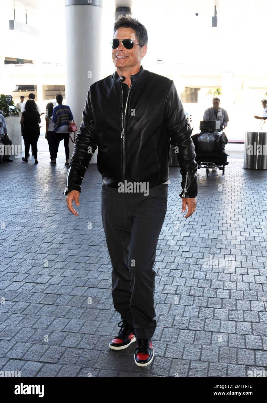 Sporting a fitted leather jacket, Rob Lowe is spotted in LAX airpot ...