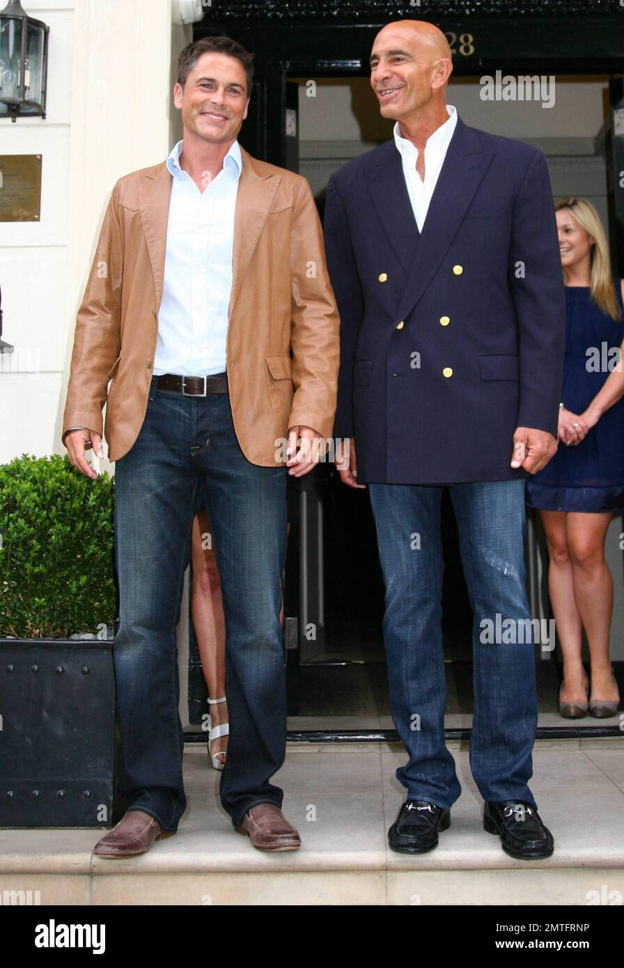 Actor Rob Lowe waves to photographers as he leaves a private members ...