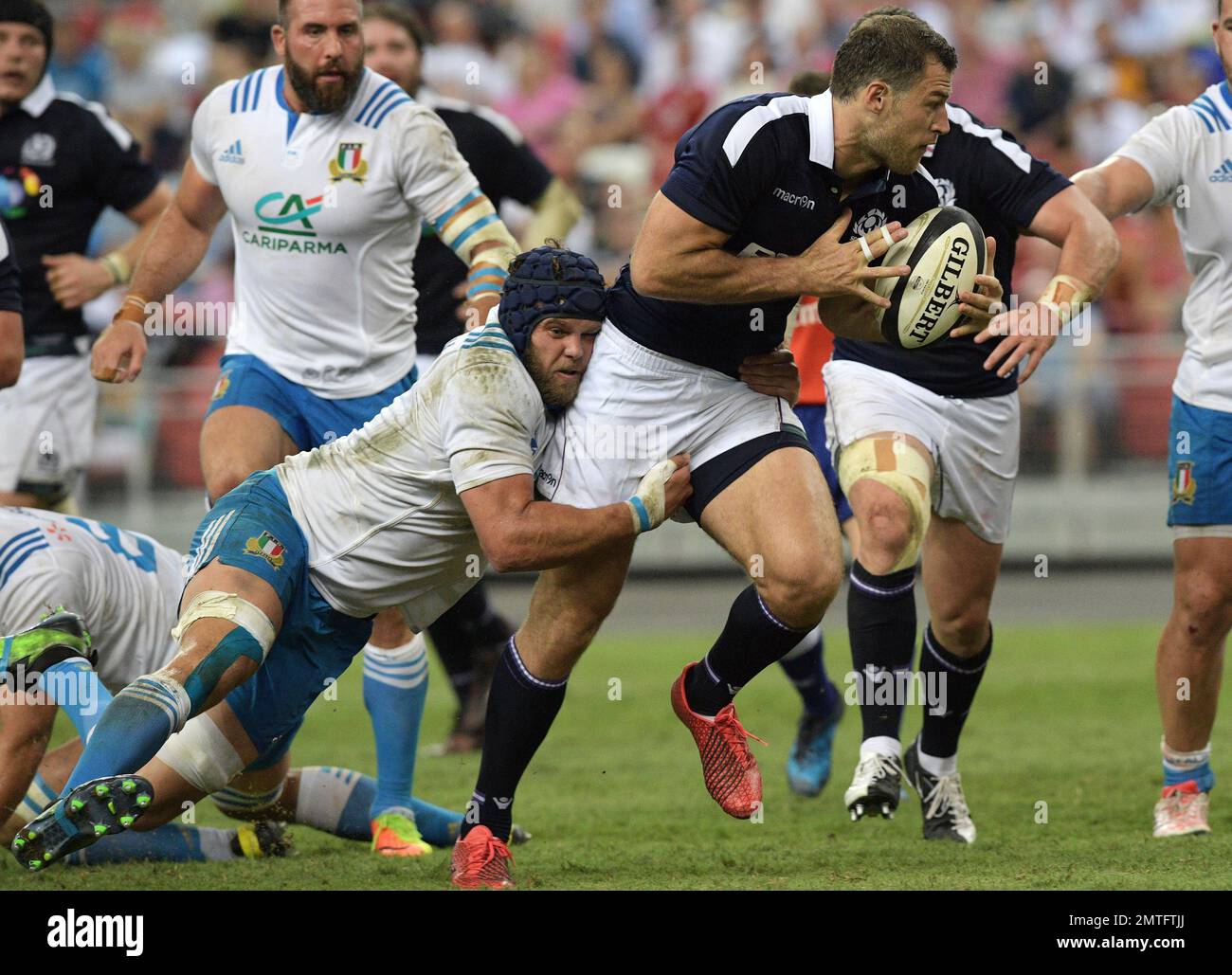 Scotland's Tim Visser, right, is tackled by Italy's Dean Budd during a ...
