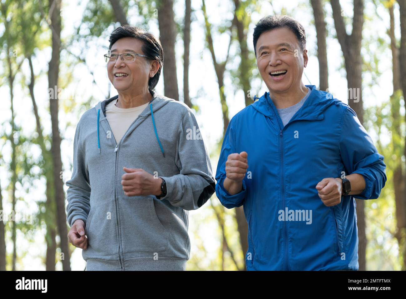 Two wear sports watch old men running in the gym Stock Photo - Alamy