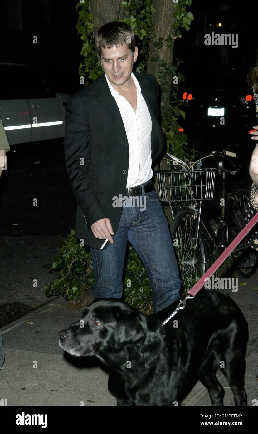 Rob Thomas leaves the Waverly Inn and stop to say hi to a friendly dog ...