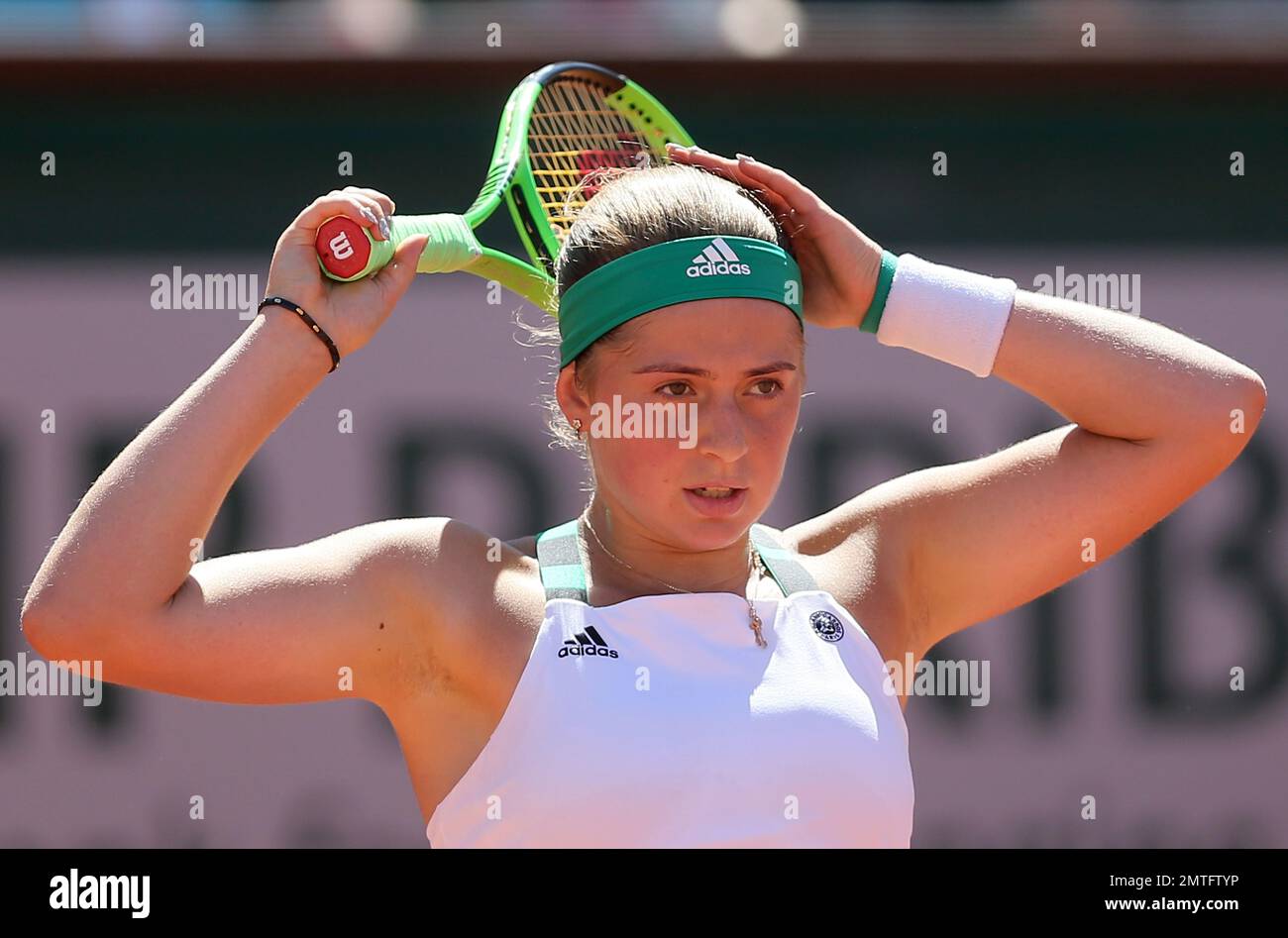 Latvia's Jelena Ostapenko adjusts her hair as she plays Romania's ...