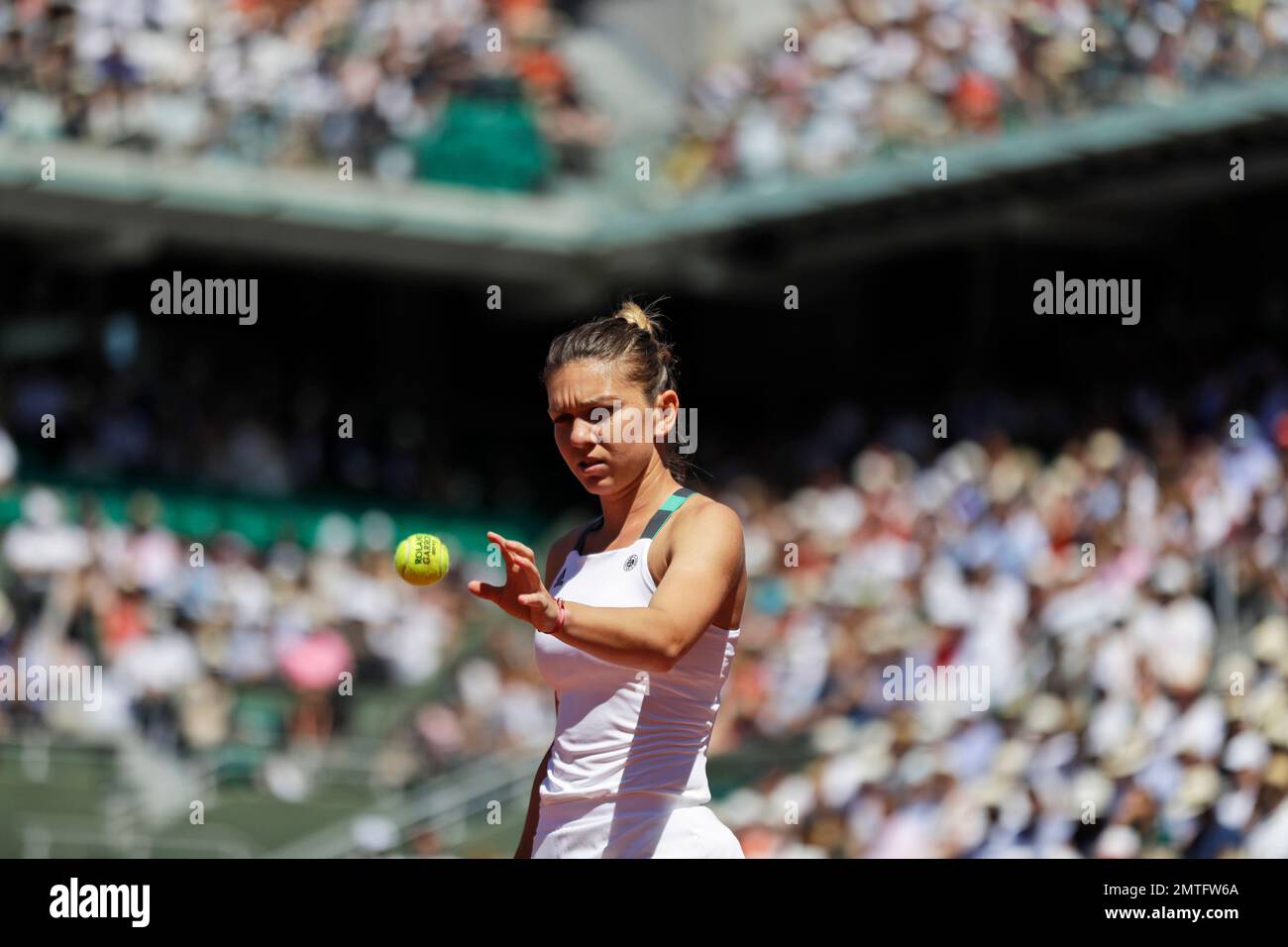 Romania's Simona Halep accepts a ball as she prepares to serve against ...