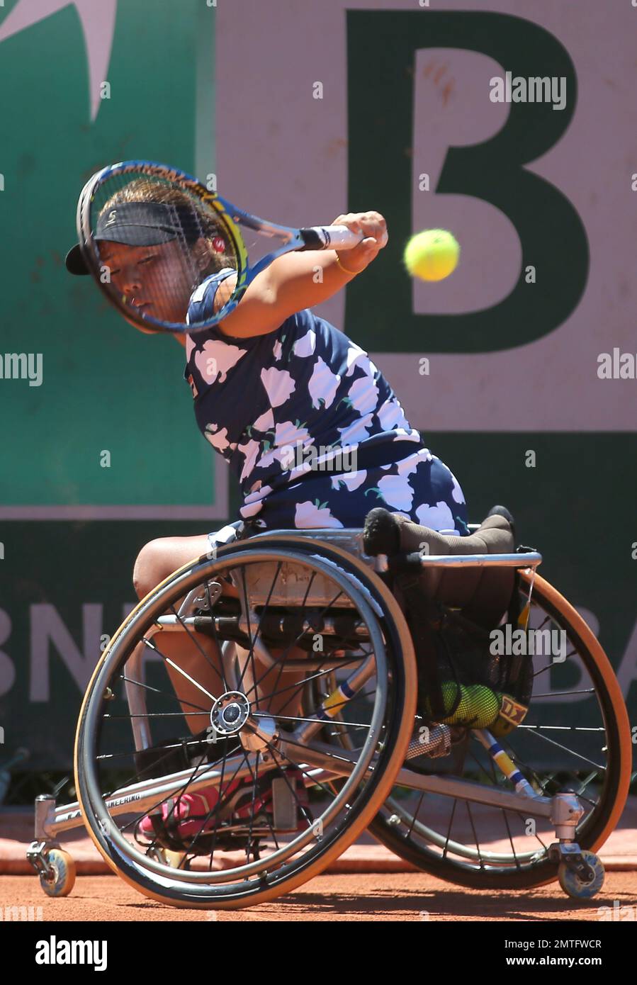 Japan's Yui Kamiji returns the ball to Germany's Sabine Ellerbrock ...