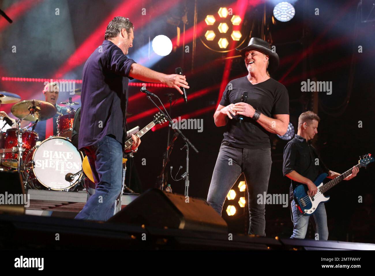 From left, artist Blake Shelton goes in for a hug with Trace Adkins at ...