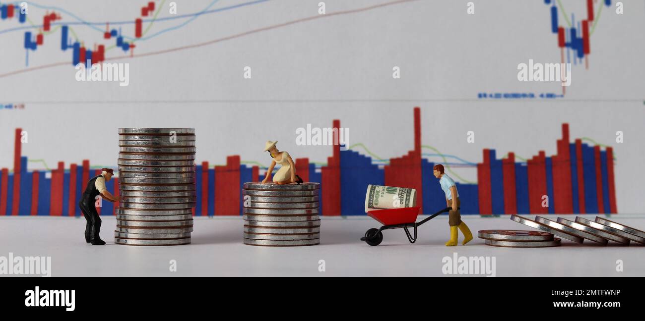 Miniature people pile coins graphs hi-res stock photography and images ...