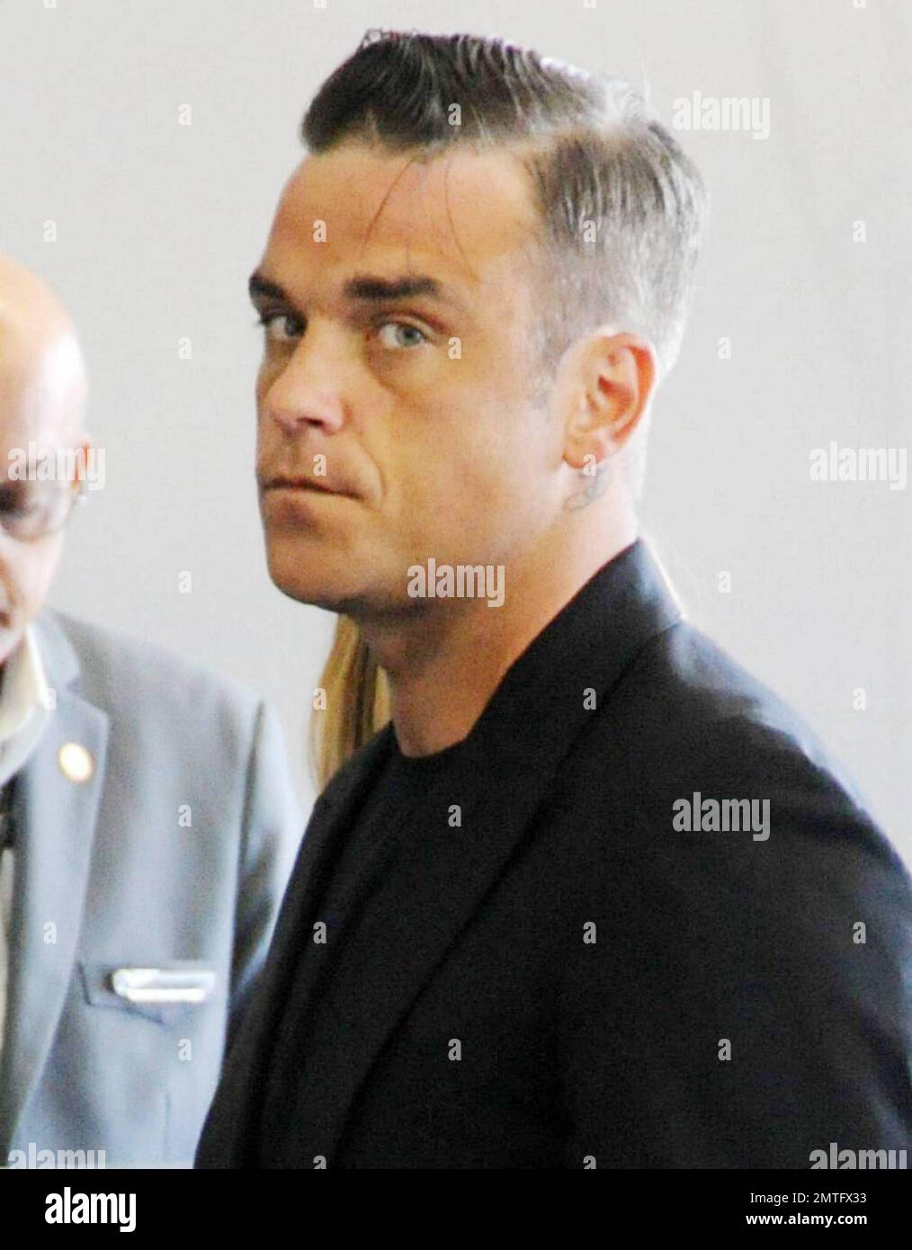 Pop singer Robbie Williams arrives at LAX with his fiancee, Turkish ...