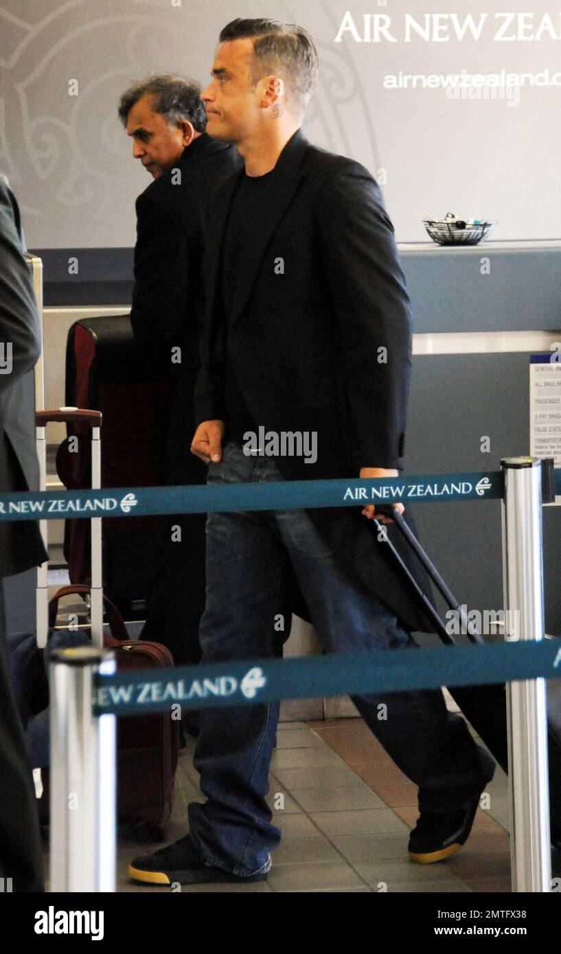 Pop singer Robbie Williams arrives at LAX with his fiancee, Turkish ...