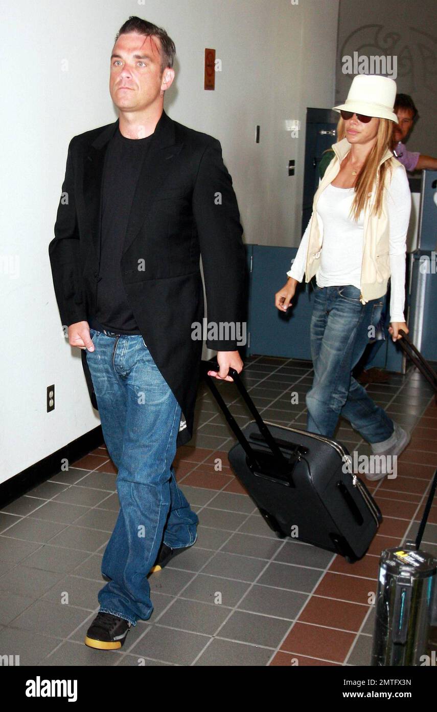 Pop singer Robbie Williams arrives at LAX with his fiancee, Turkish ...
