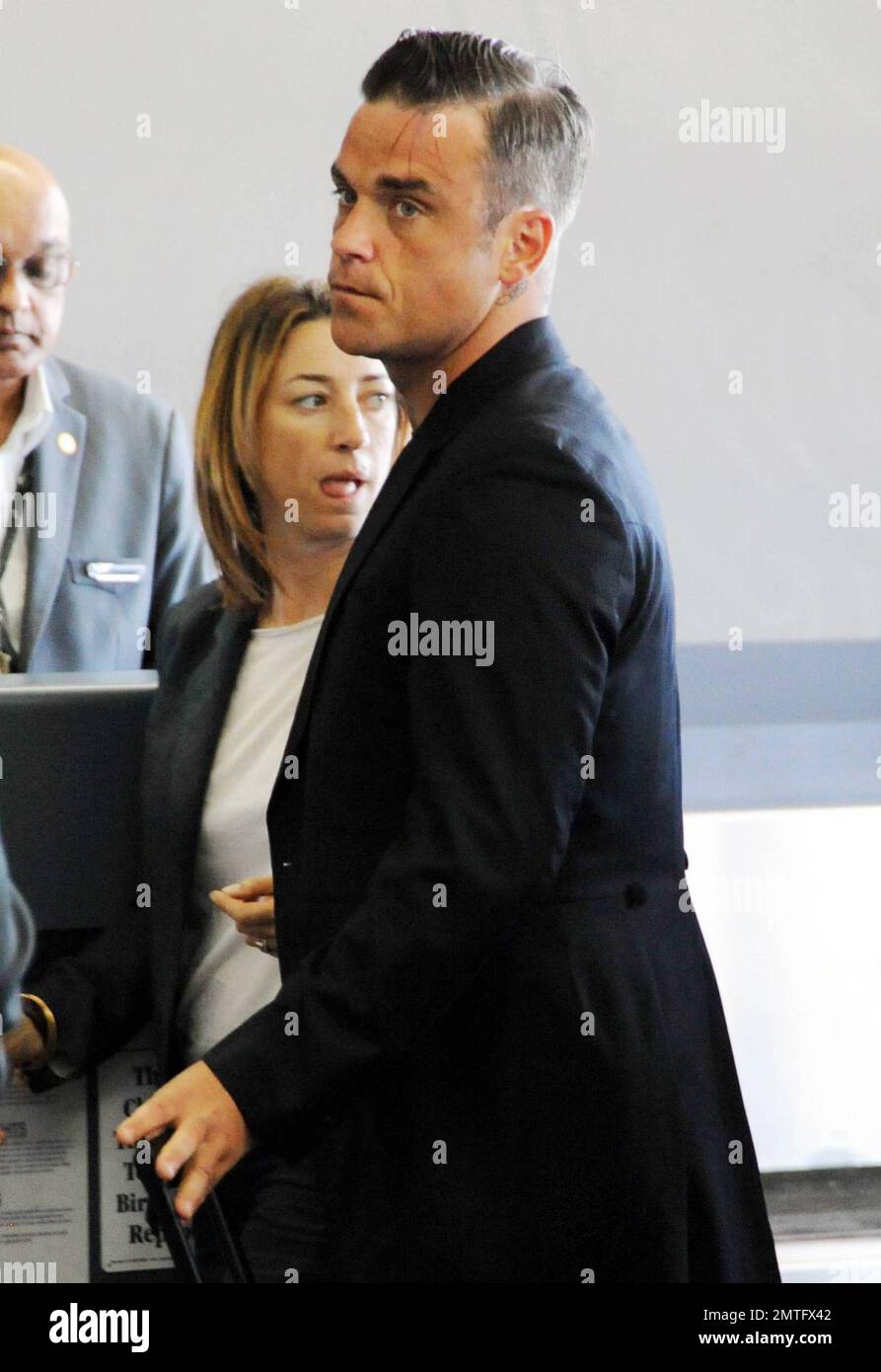 Pop singer Robbie Williams arrives at LAX with his fiancee, Turkish ...