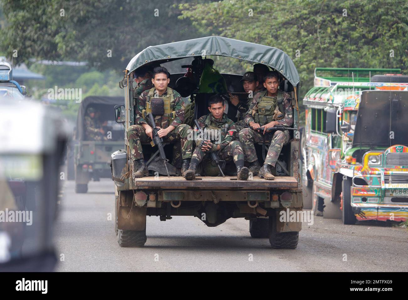 In this June 9, 2017, photo, soldiers ride a military vehicle on the ...