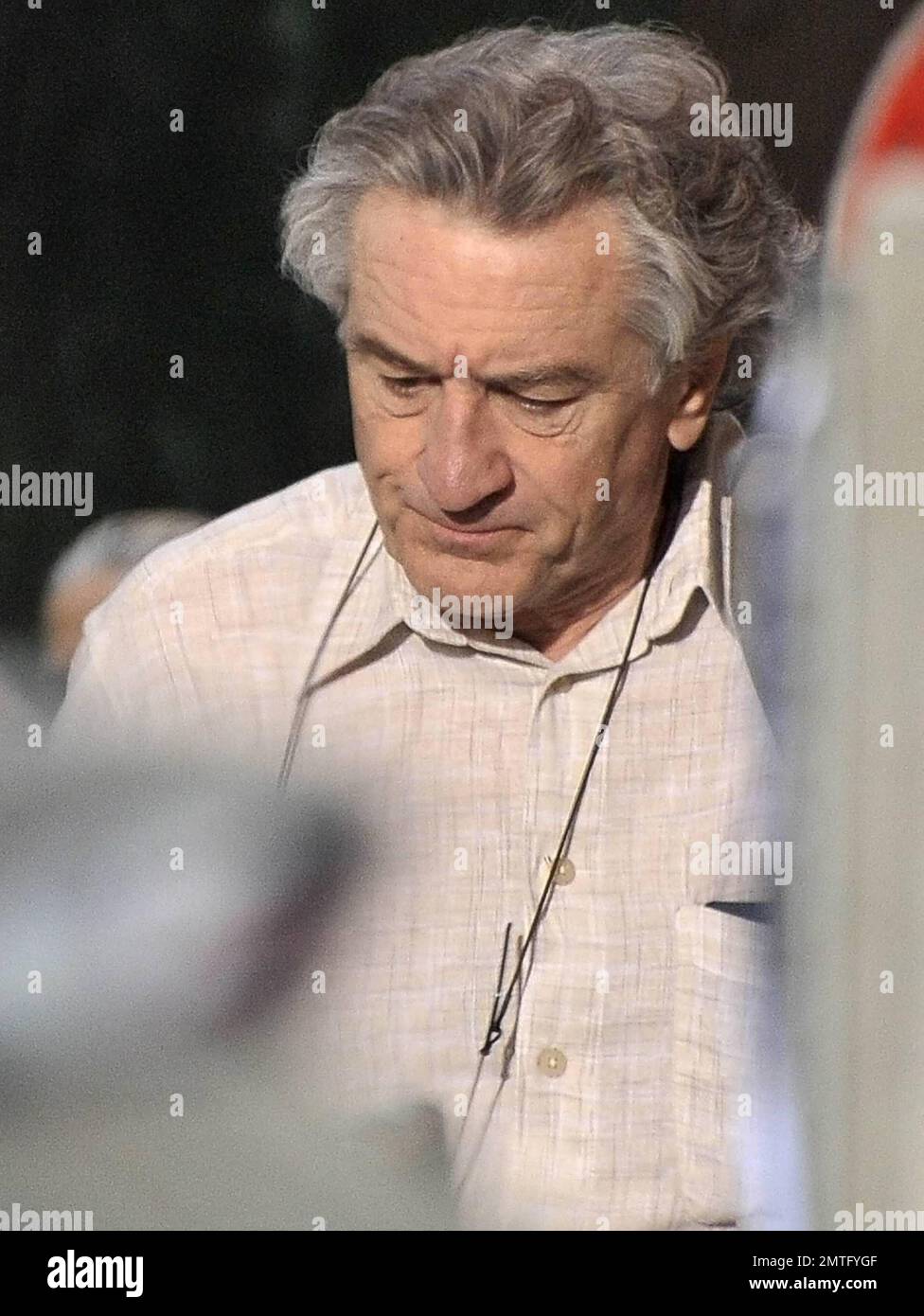 Veteran actor Robert De Niro walks to a waiting car after filming on ...