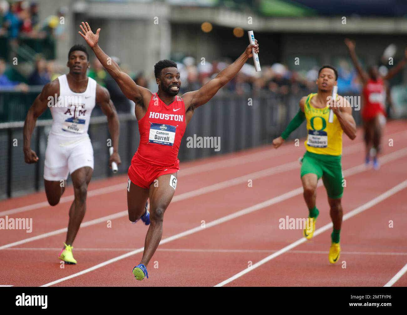 Houston's Cameron Burrell raises his arms in victory in after crossing ...