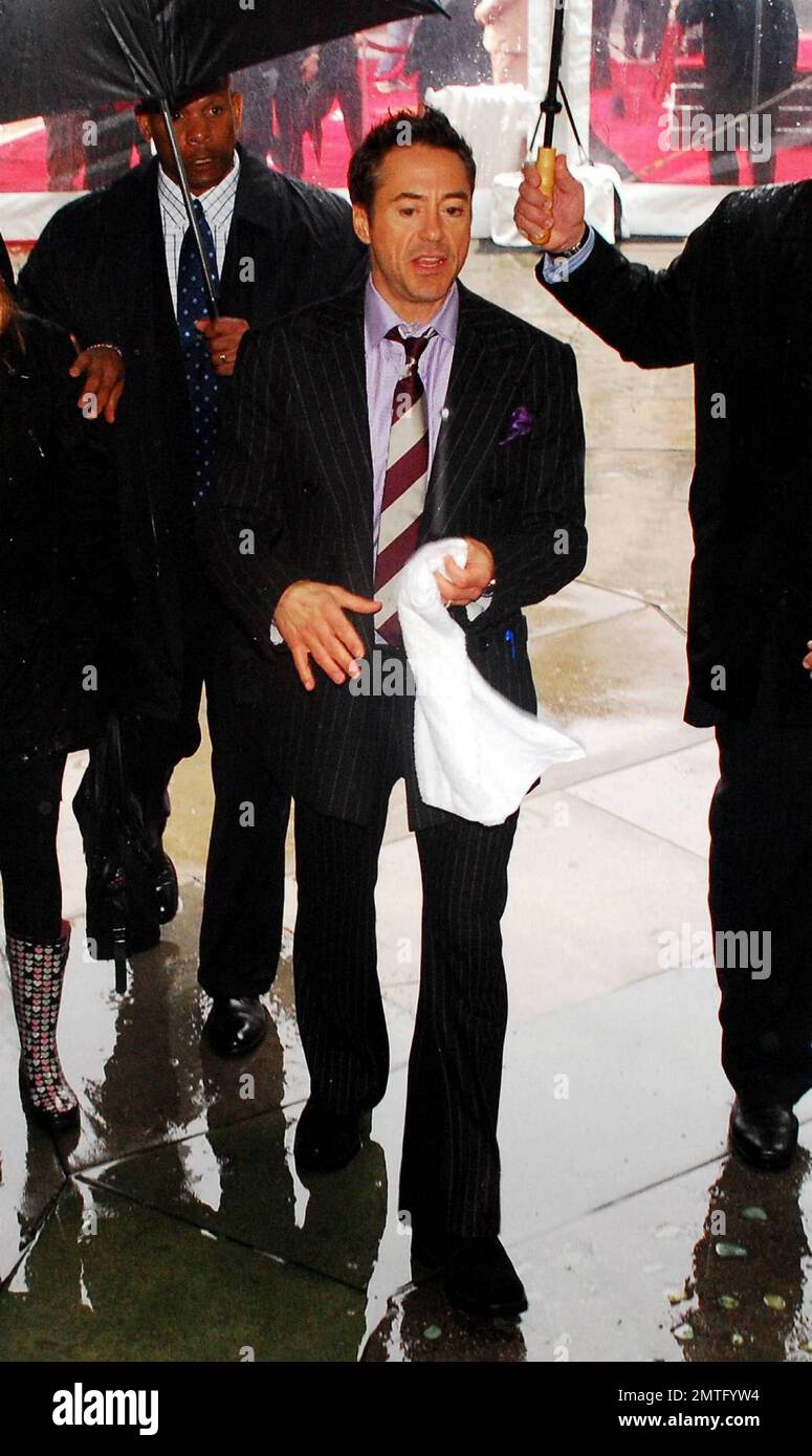 Robert Downey Jr braves a dismal rainy day in LA as he leaves the dry ...