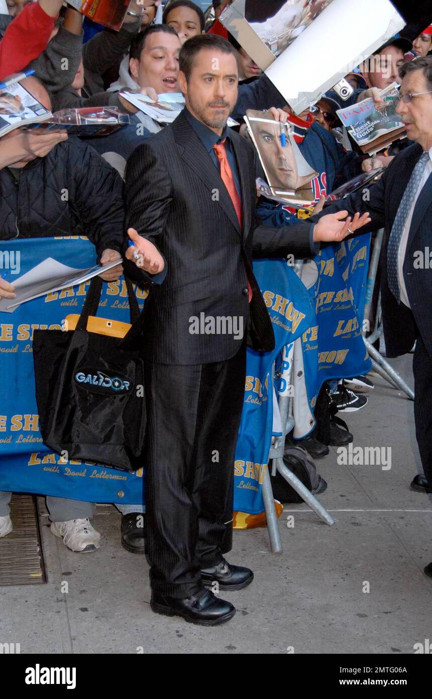 Robert Downey, Jr. signs autographs for fans outside the "Late Show ...