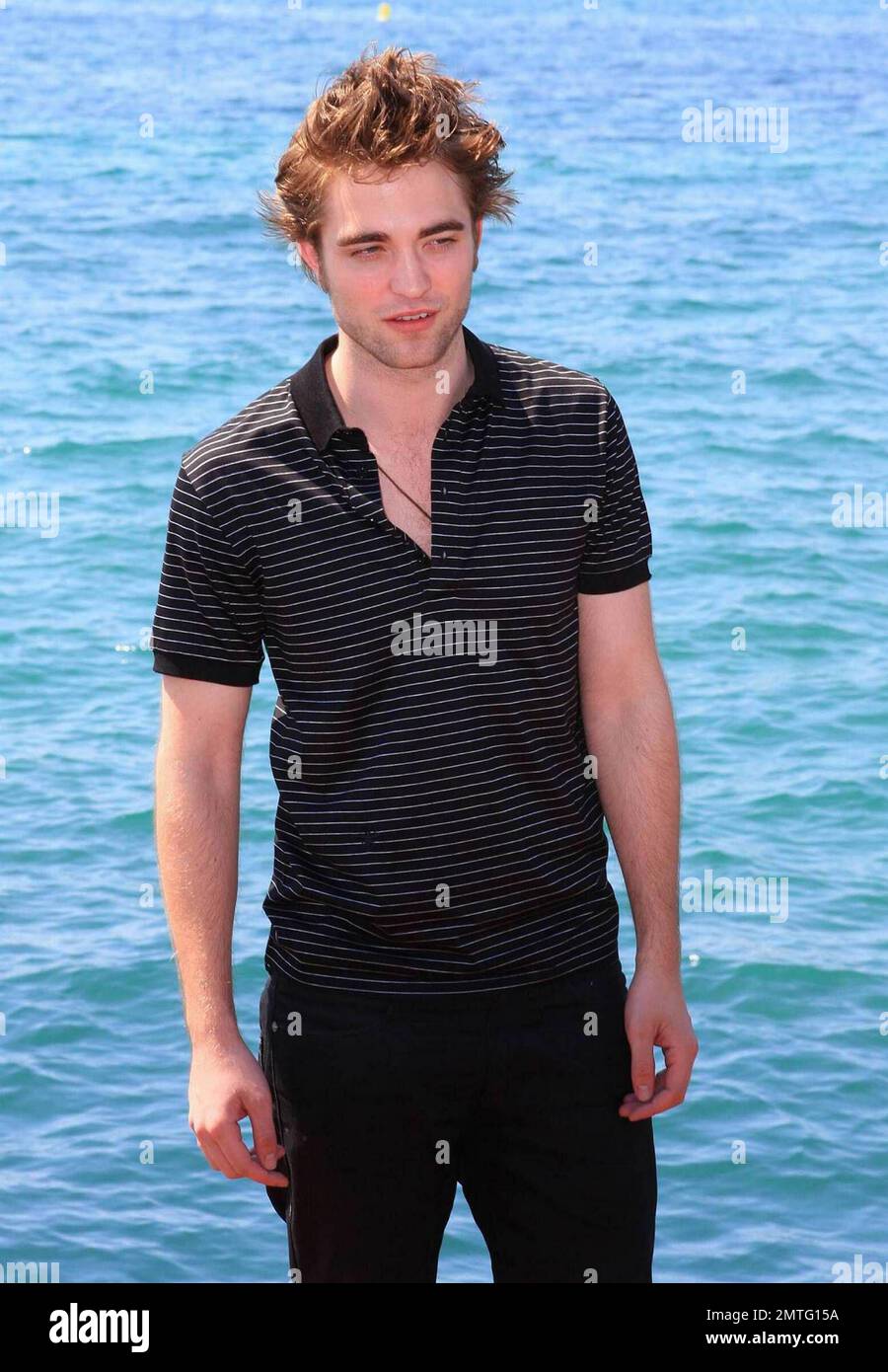 Robert Pattinson poses for the cameras at the Cannes Film Festival. The ...