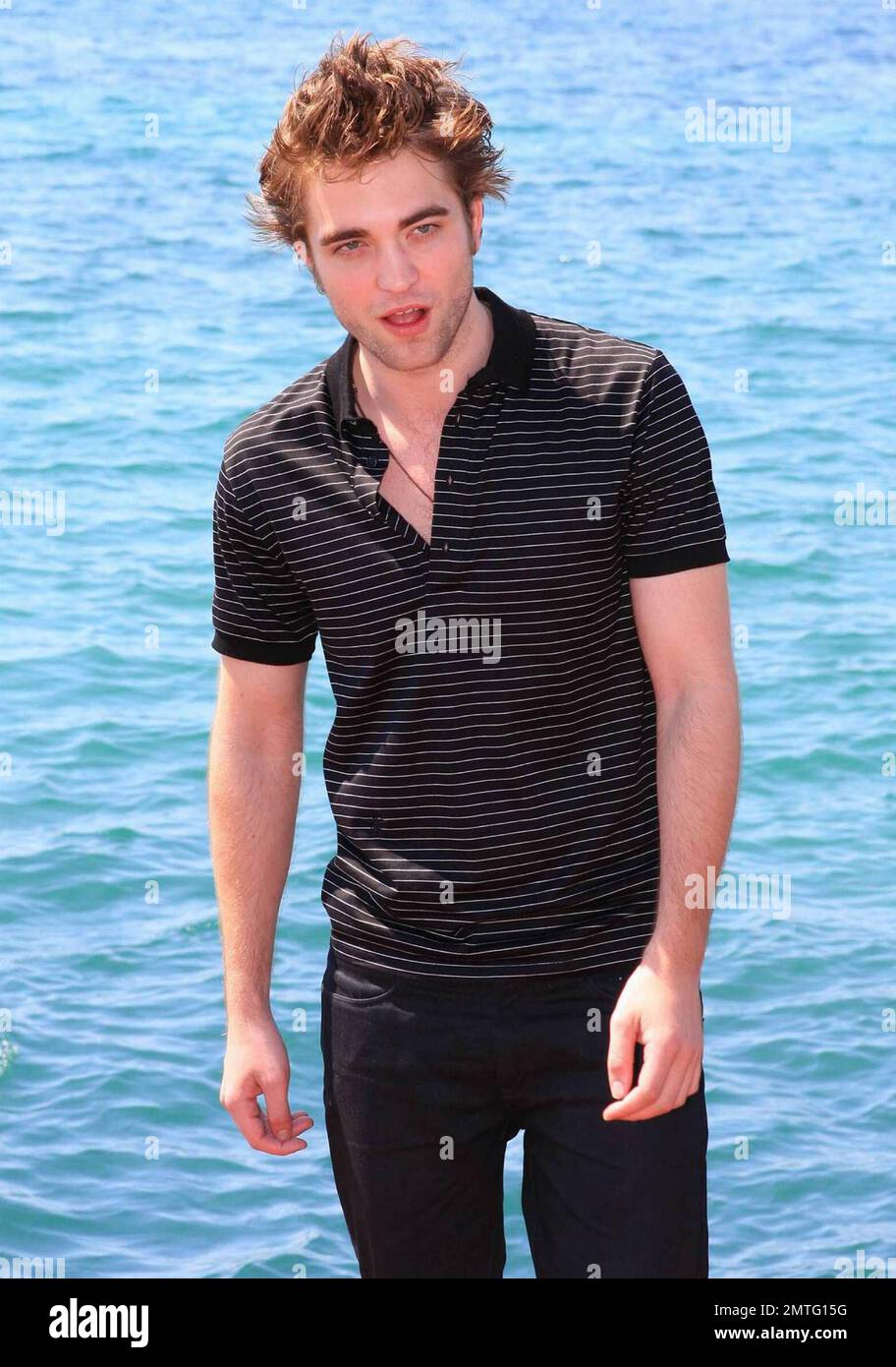 Robert Pattinson poses for the cameras at the Cannes Film Festival. The ...