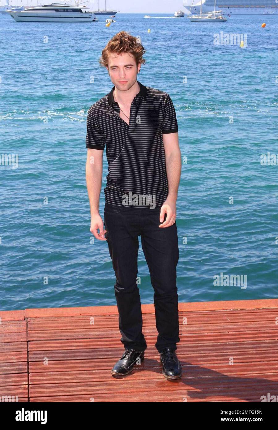 Robert Pattinson poses for the cameras at the Cannes Film Festival. The newly crowned heart ...