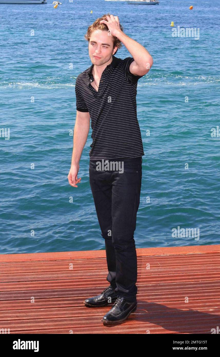 Robert Pattinson poses for the cameras at the Cannes Film Festival. The ...