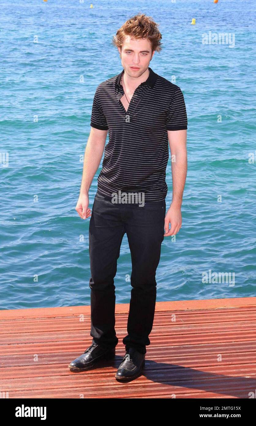Robert Pattinson poses for the cameras at the Cannes Film Festival. The ...